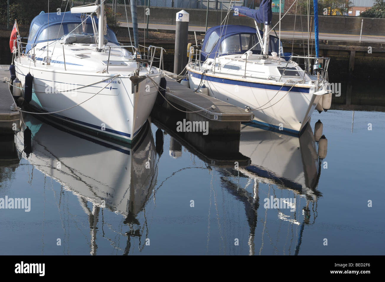 2 white boats reflected Stock Photo - Alamy