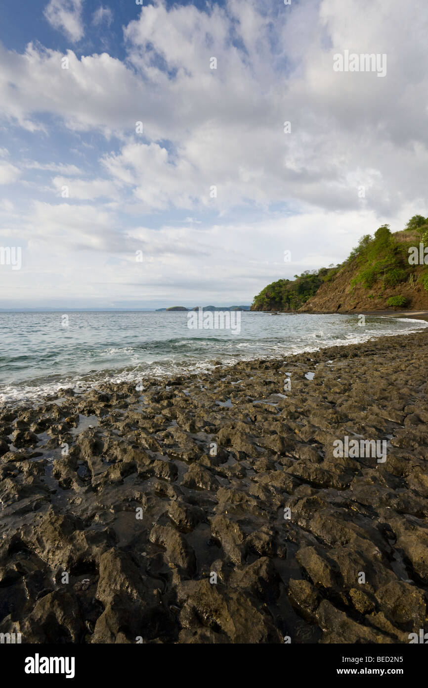 Sea meets the volcanic coast of Playa Ocotal, Guanacaste Province ...