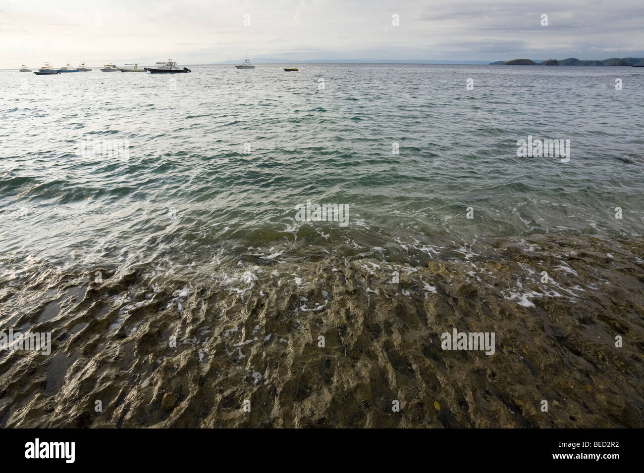 Sea meets the volcanic coast of Playa Ocotal, Guanacaste Province ...