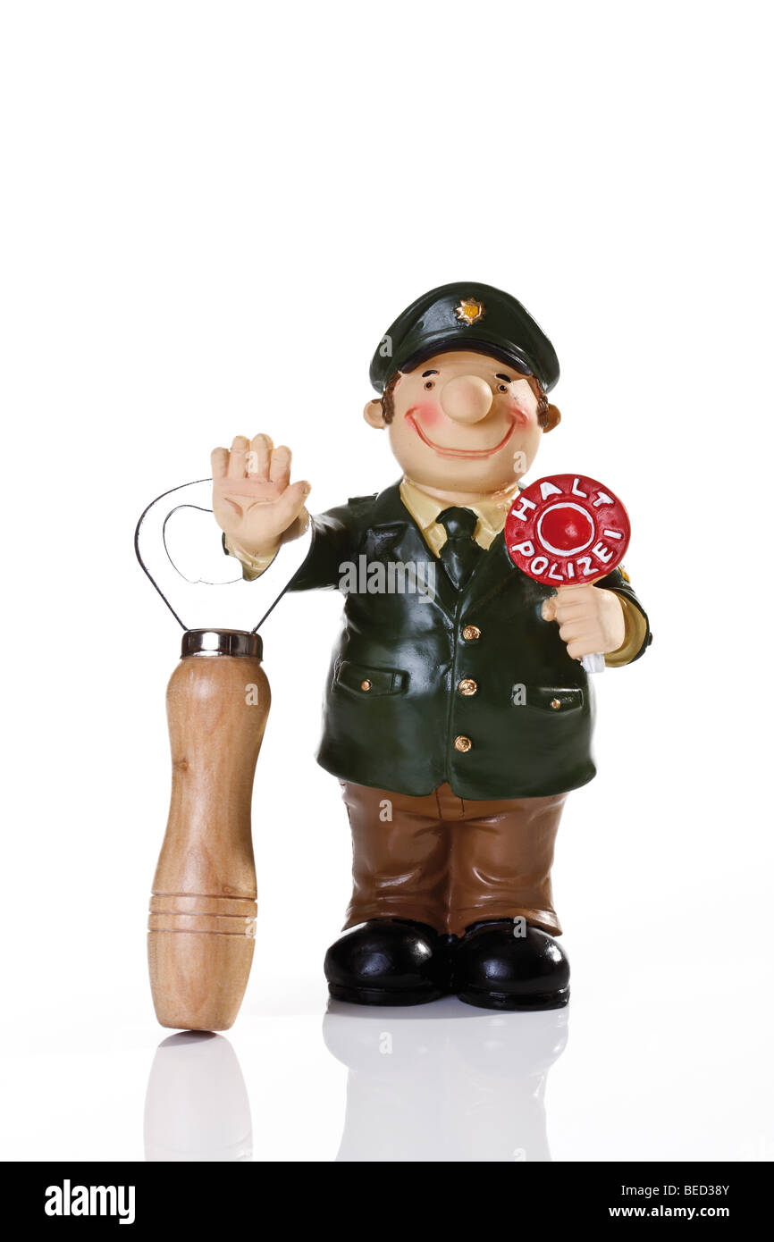 Miniature figure of a police man with a bottle opener Stock Photo - Alamy