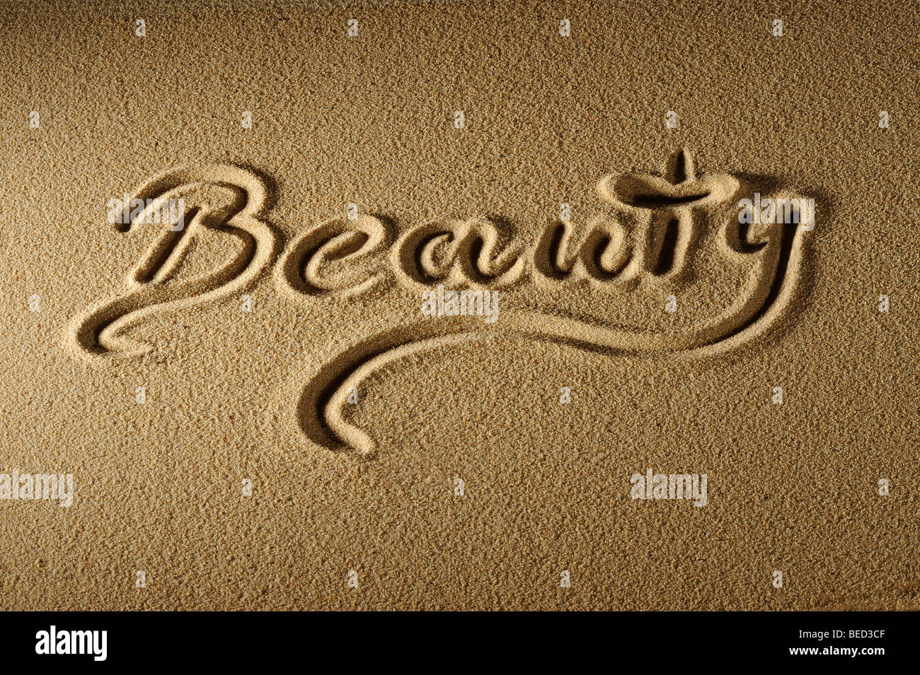 "Beauty" written in sand Stock Photo - Alamy