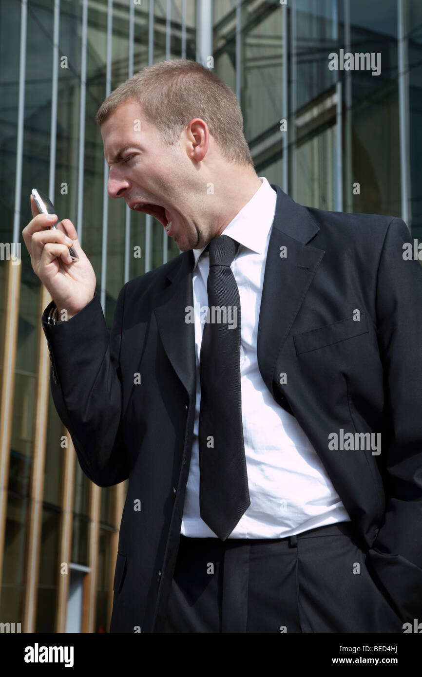 Business man yelling at phone Stock Photo - Alamy