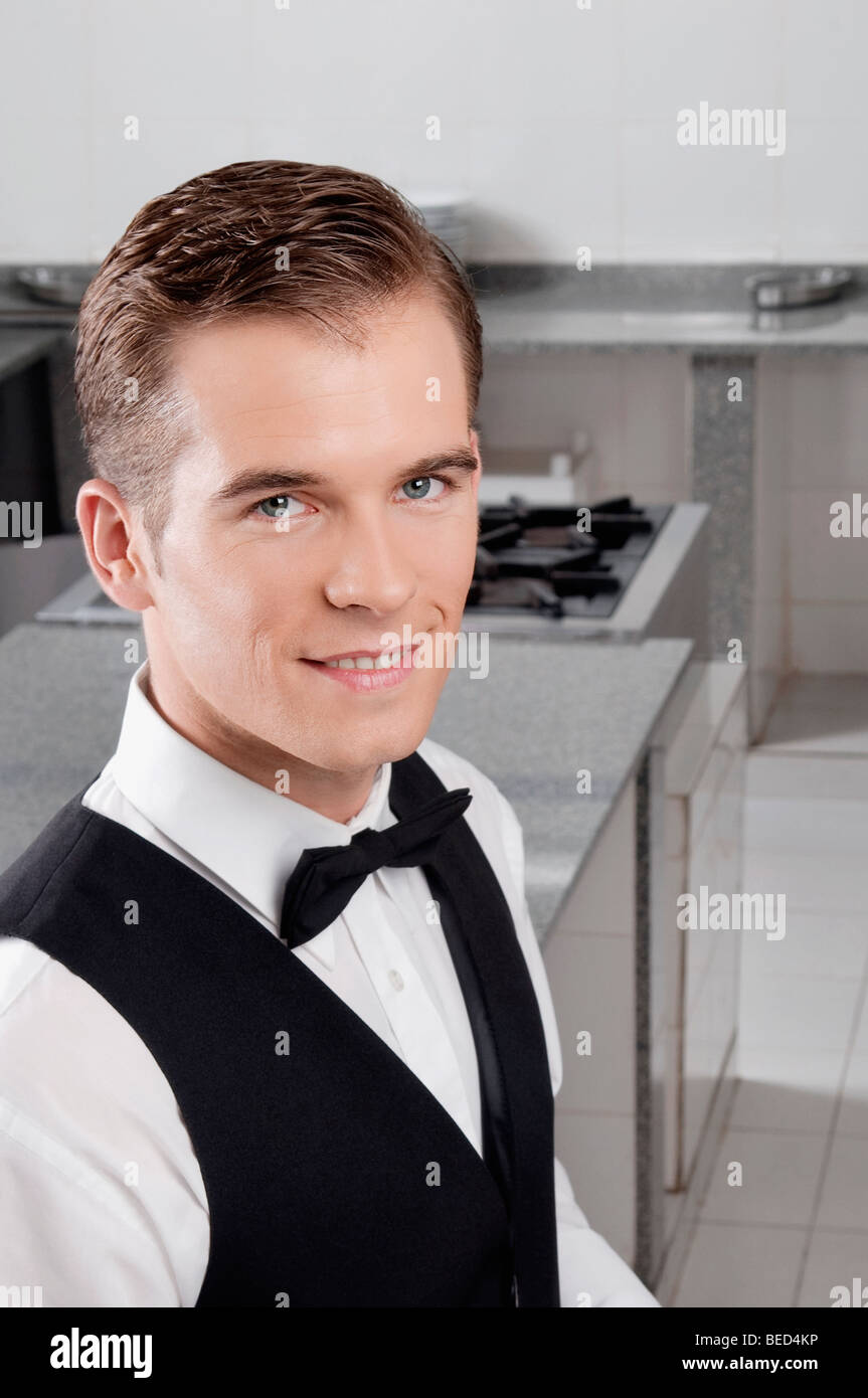 Portrait of a waiter smiling Stock Photo - Alamy