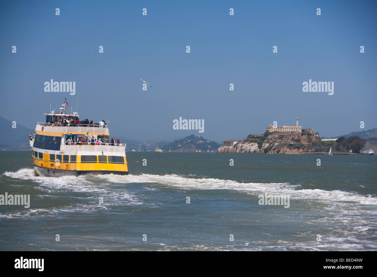 Ferry in the sea with a prison in the background,Alcatraz Prison ...