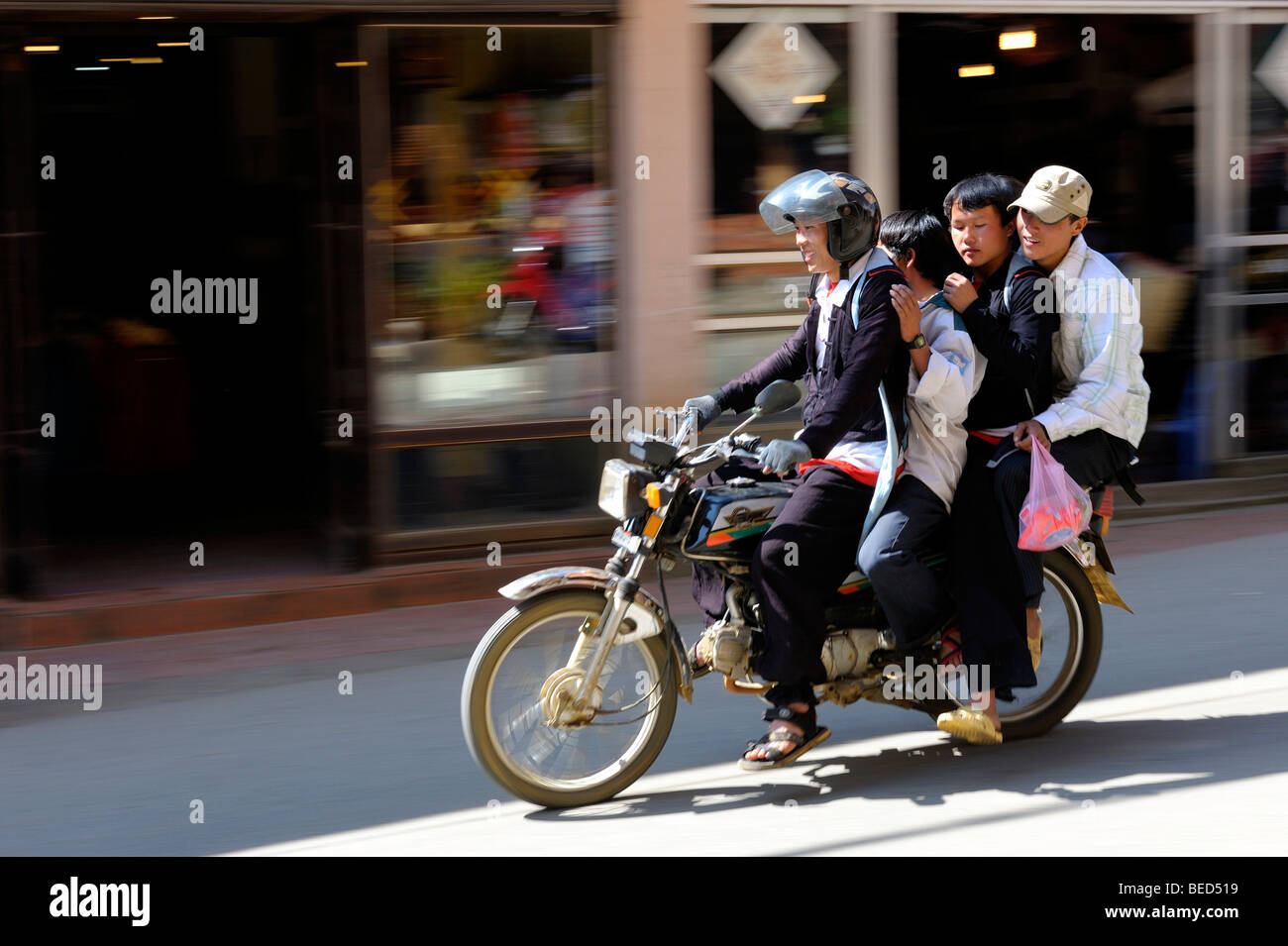 Four Vietnames people on a moped, Sapa, Hanoi, North Vietnam, Southeast ...