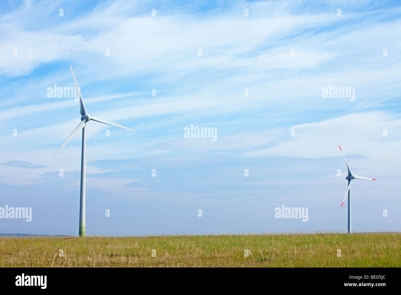 Wind Turbines in line in the field Stock Photo - Alamy