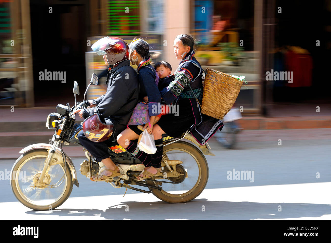 Four Vietnames people on a moped, Sapa, Hanoi, North Vietnam, Southeast ...