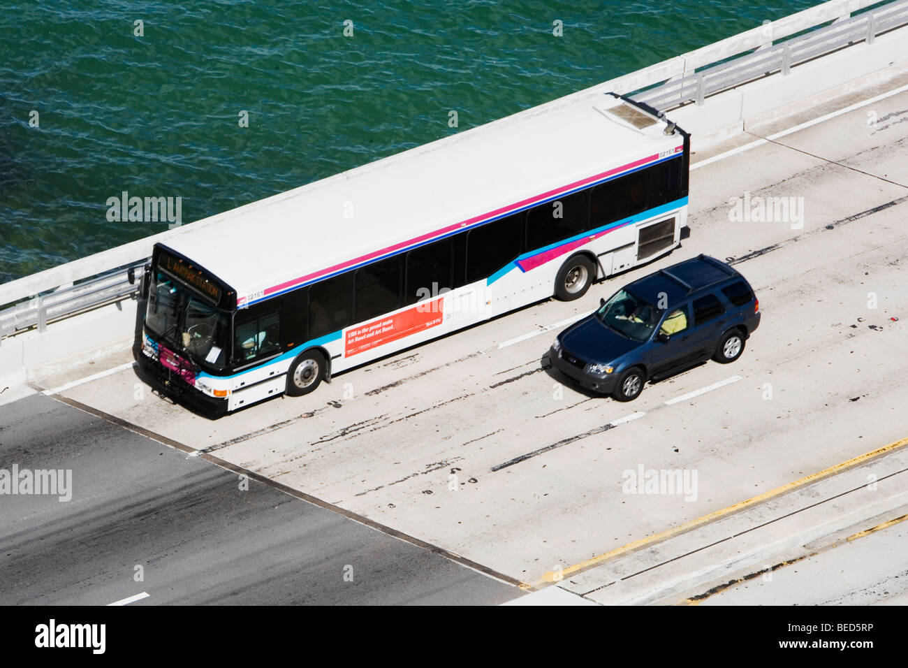 High angle view of a bus and a car moving on a bridge Stock Photo - Alamy