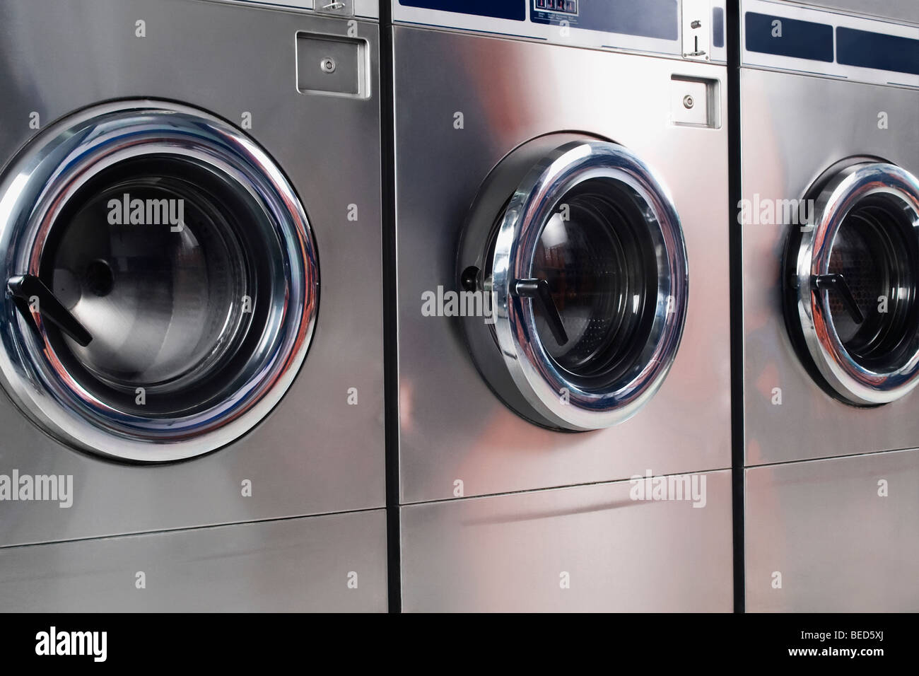 Photography of a washing machine in a launderette hi-res stock ...