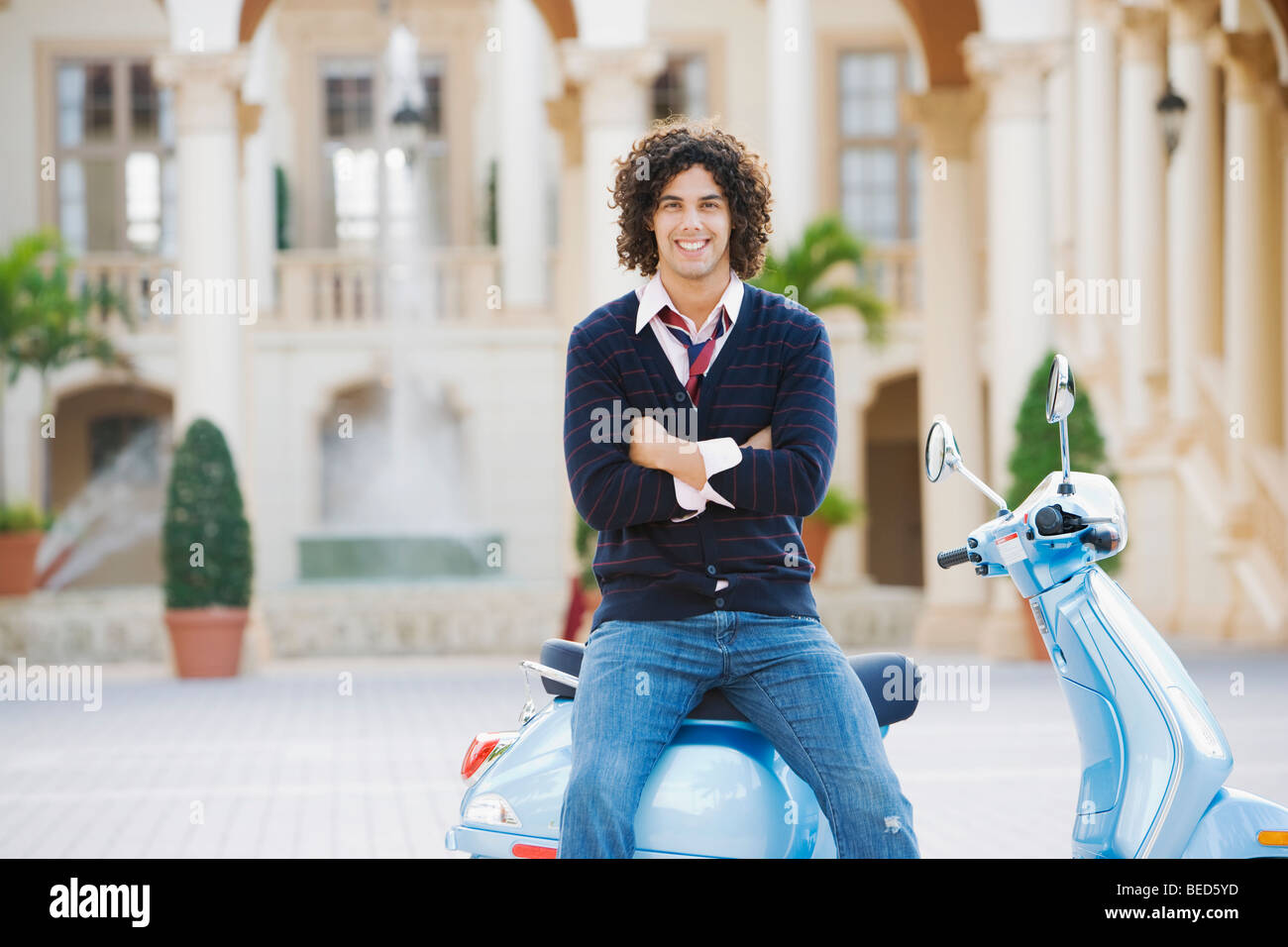 Man sitting on a moped with his arm crossed, Biltmore Hotel, Coral ...