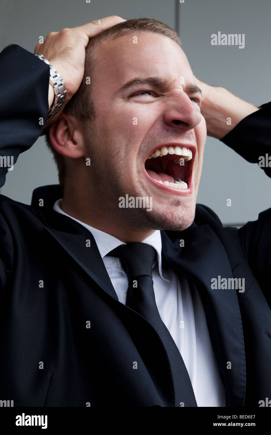 Man in suit yelling side hi-res stock photography and images - Alamy