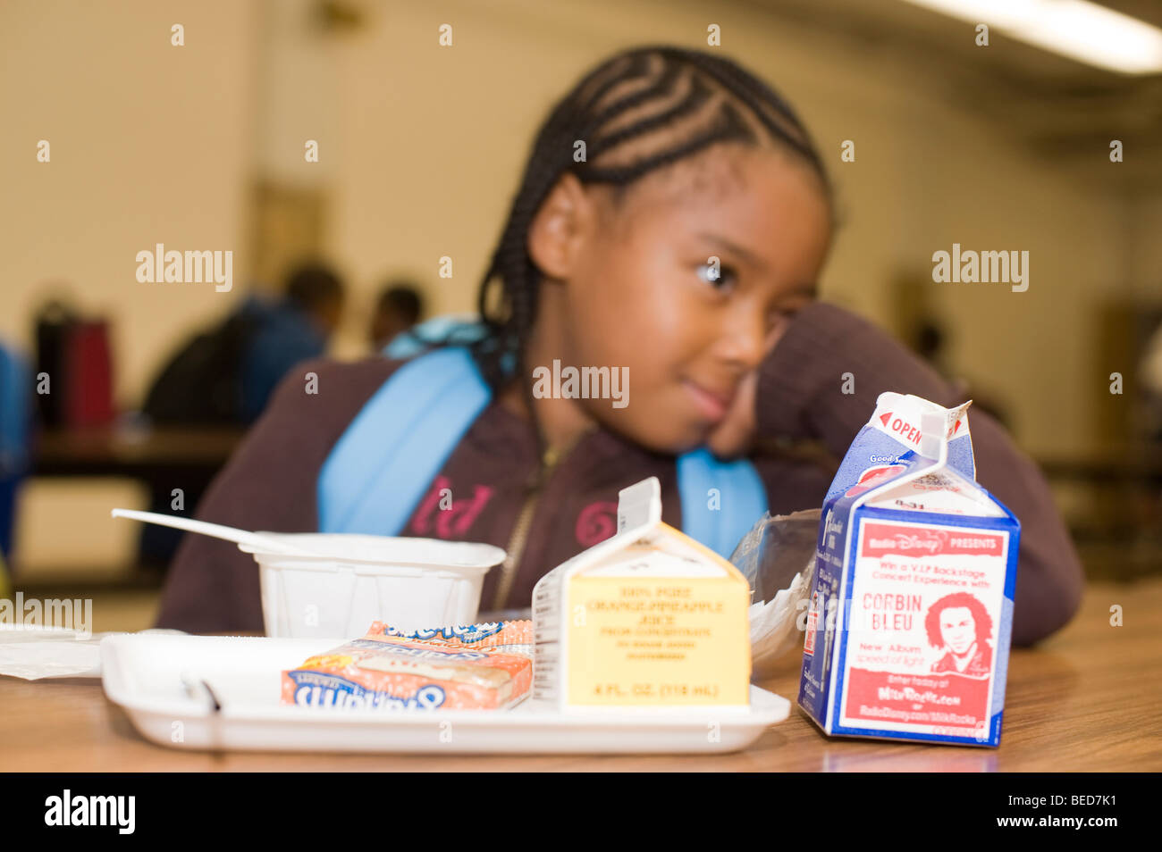 Grade school students eat a healthy breakfast at Young Achievers, a ...