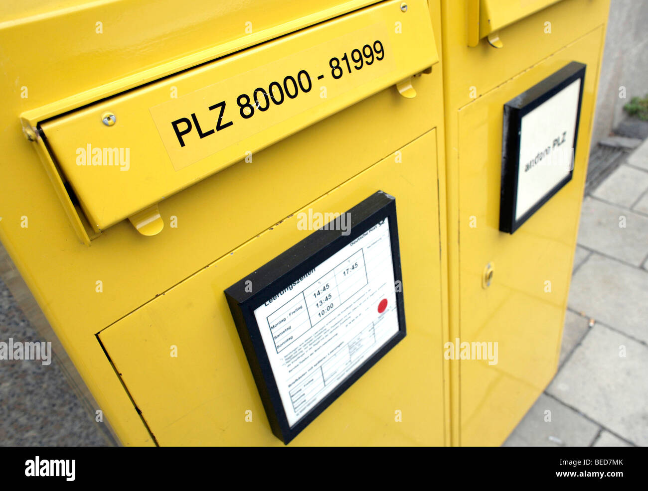 Yellow letter boxes of the Deutsche Post AG Stock Photo - Alamy