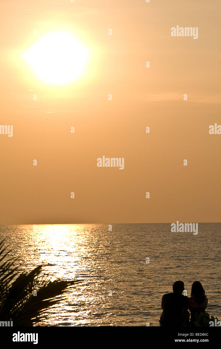 a Couple watching sunset Stock Photo - Alamy