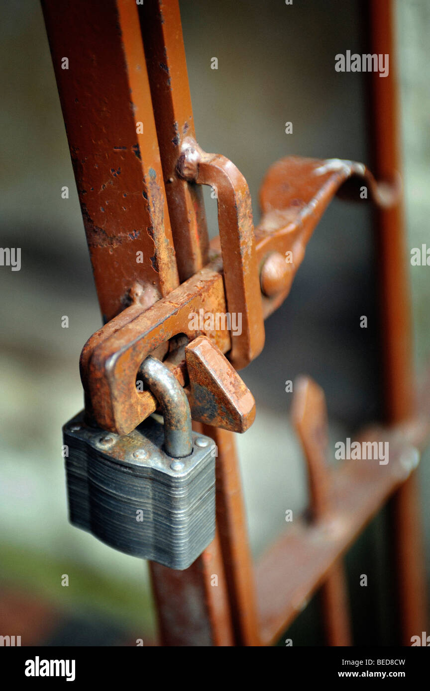 padlocked wrought iron ornamental gate Stock Photo - Alamy