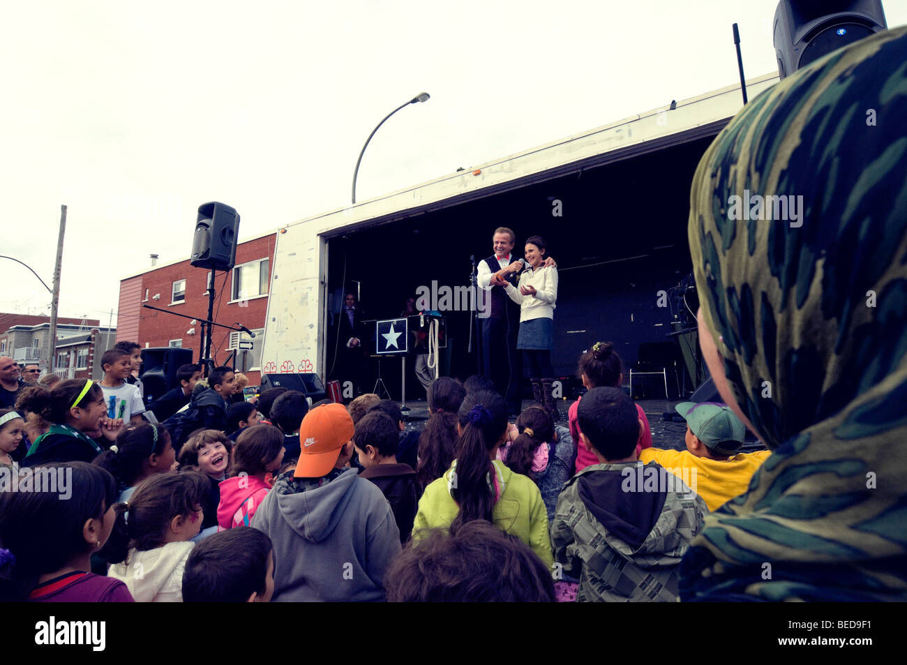 Show with Clowns during a street fair in the New district of Little ...