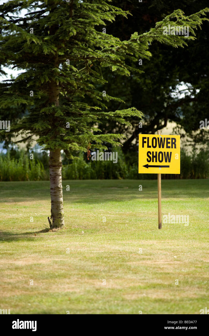 sign for flower show in classical garden Stock Photo - Alamy