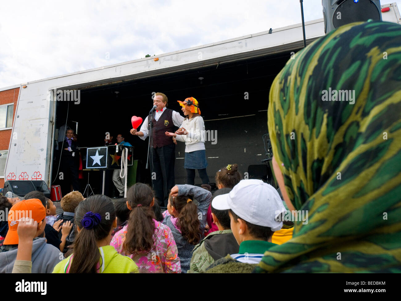 Show with Clowns during a street fair in the New district of Little ...