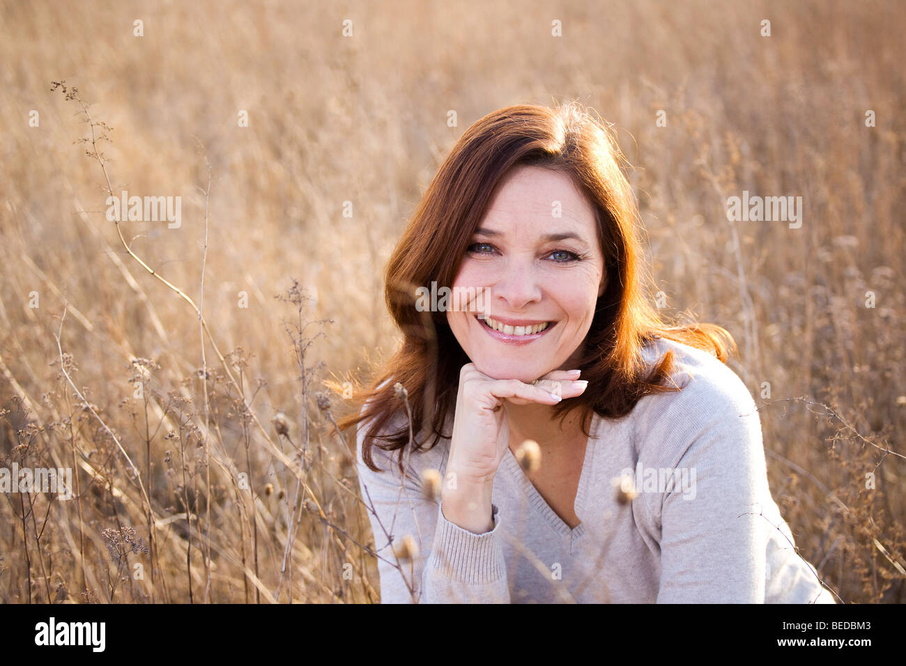 Portrait of a smiling woman Stock Photo - Alamy