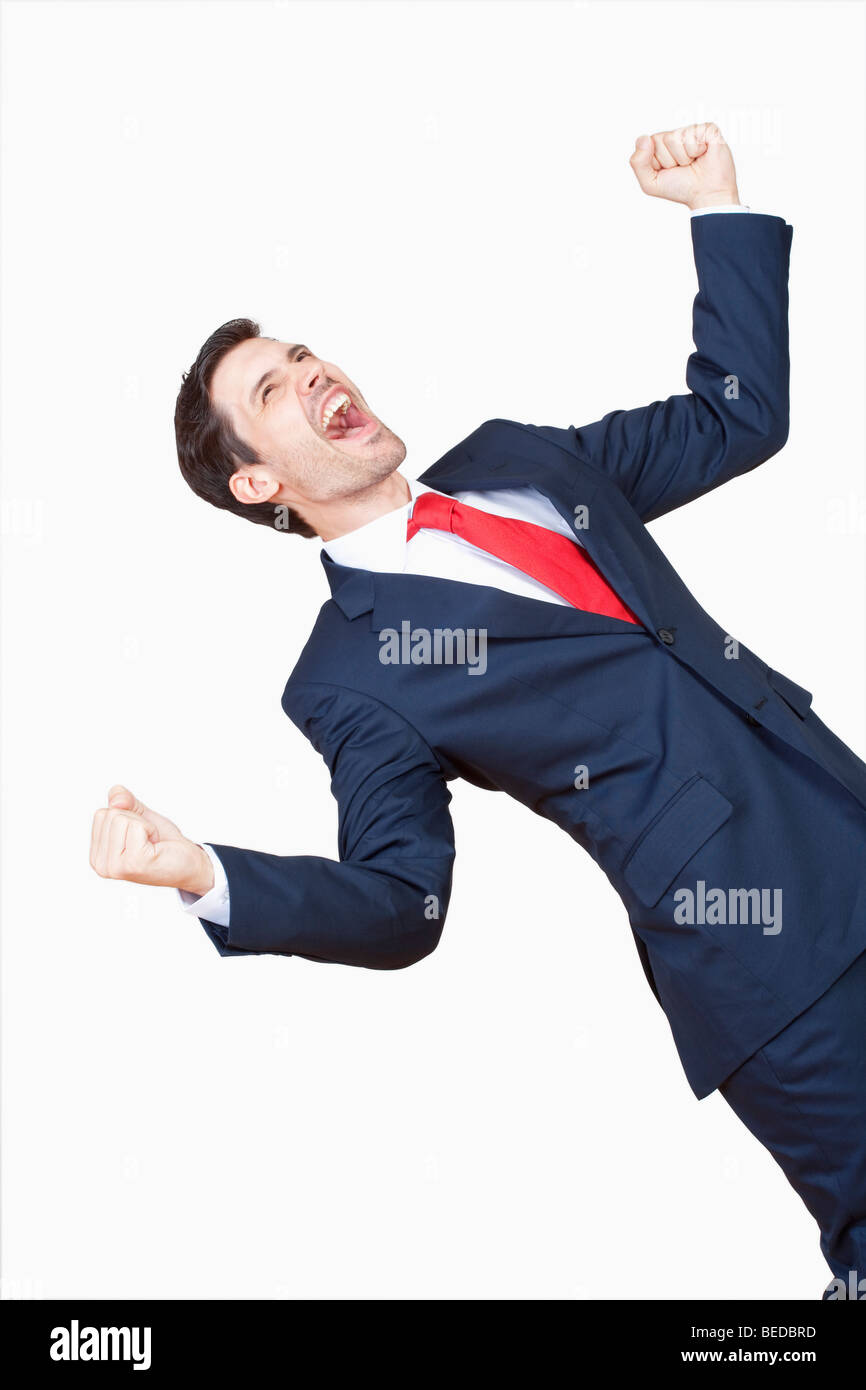 young business executive in suit cheering isolated on white Stock Photo ...