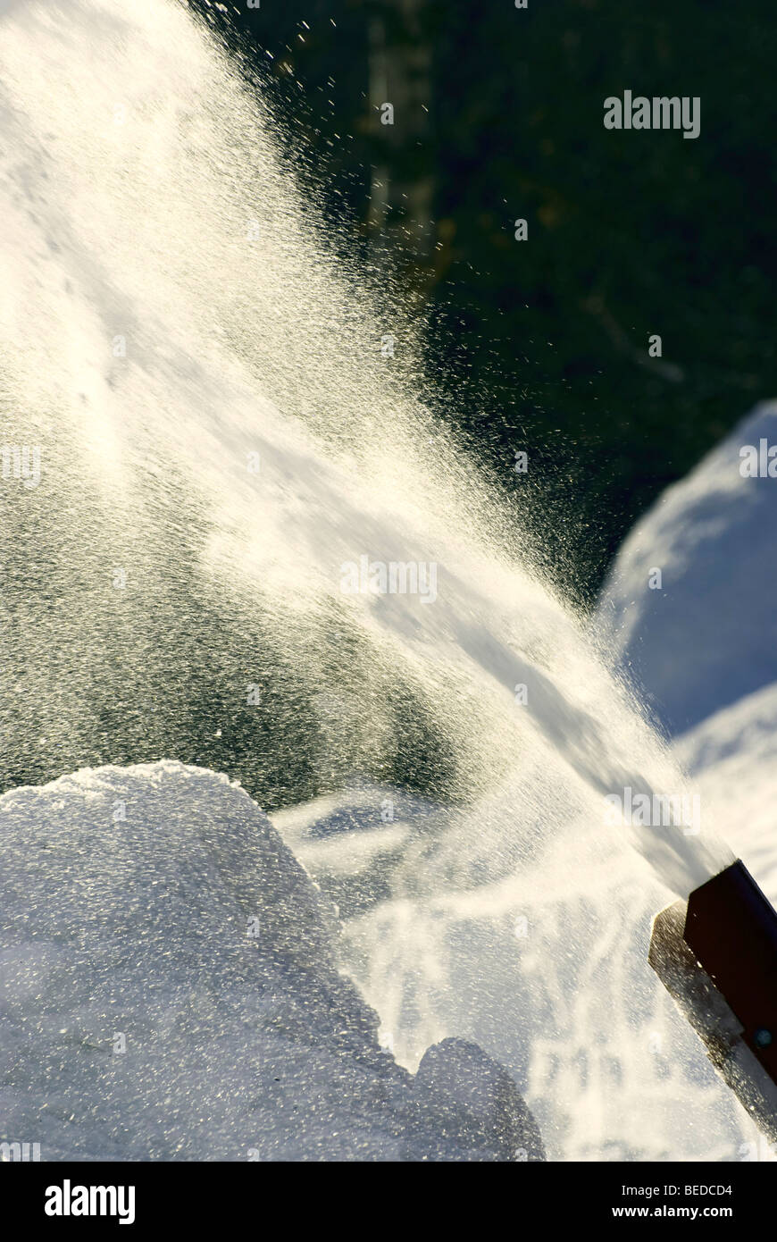 Snowblower in action in the sunlight, Graubuenden, Switzerland, Europe ...