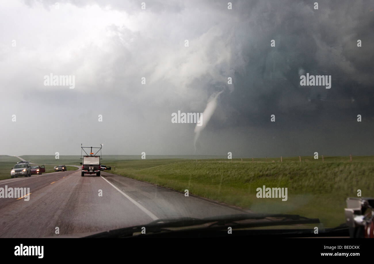 Storm chasers with Project Vortex 2 watch a tornado cross the highway ...