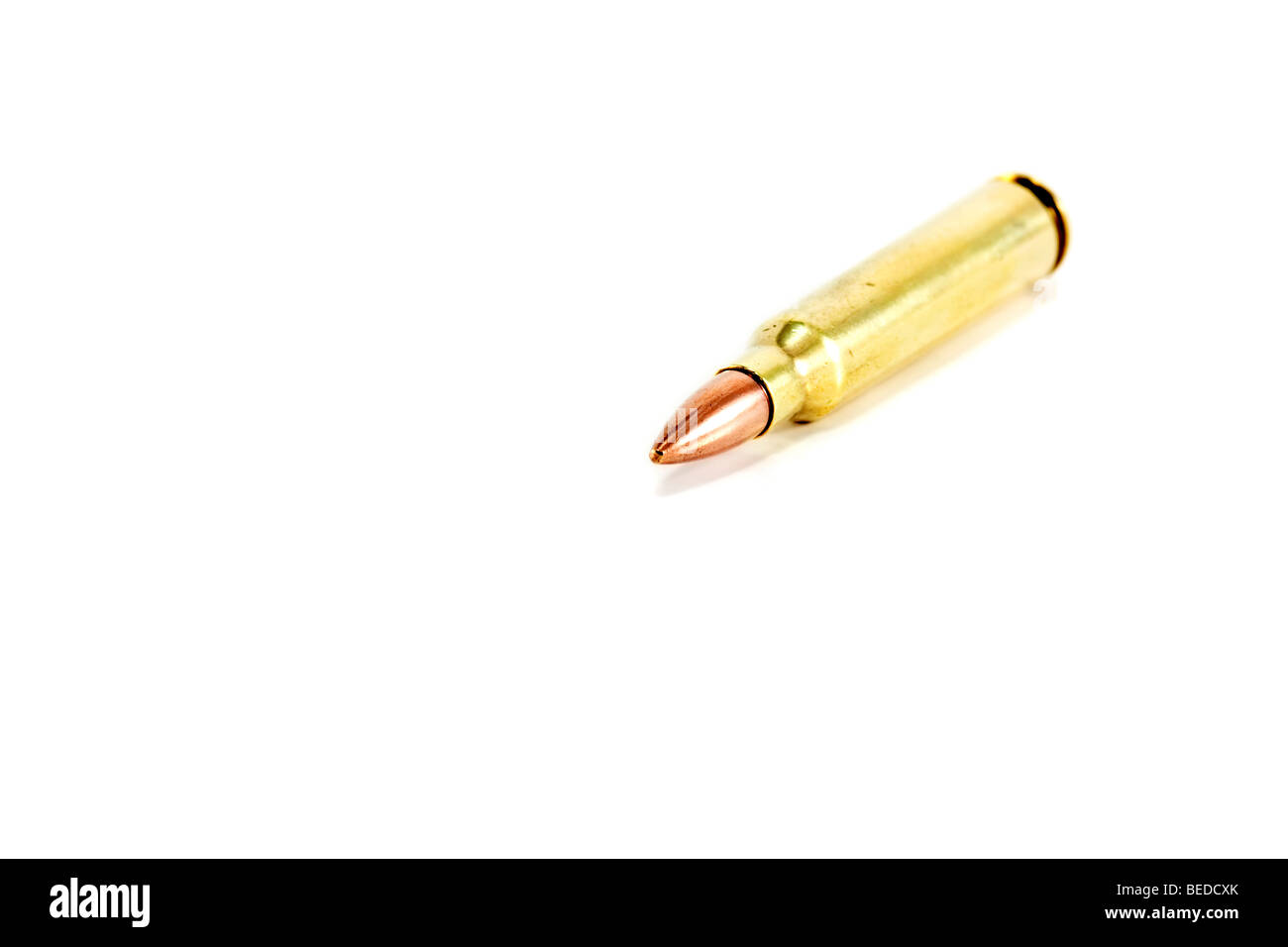 A single AK-47 bullet on white Stock Photo - Alamy