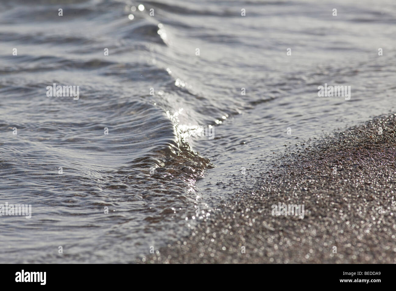 Water washing up on beach hi-res stock photography and images - Alamy