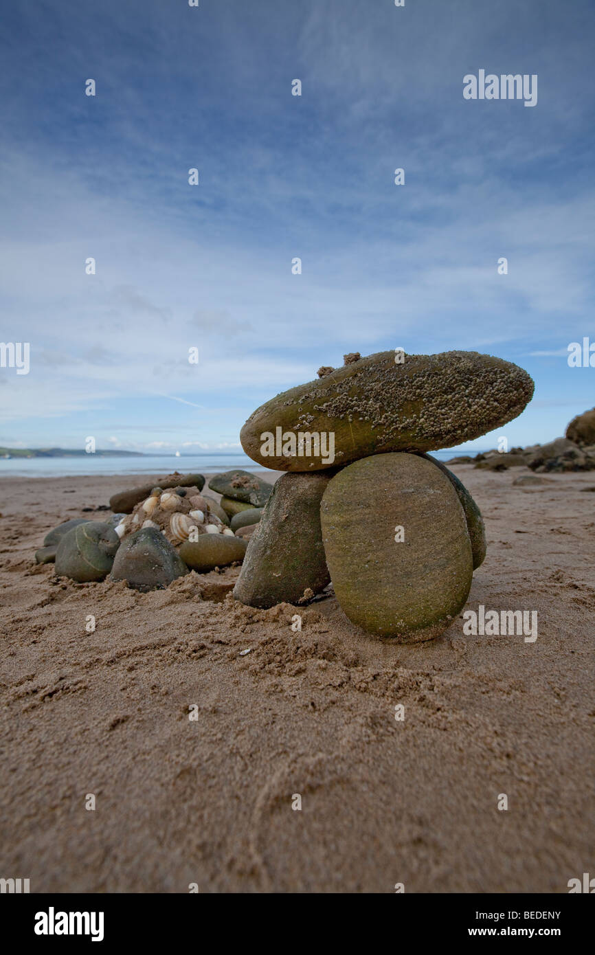 Stacked pebbles on beach Stock Photo - Alamy