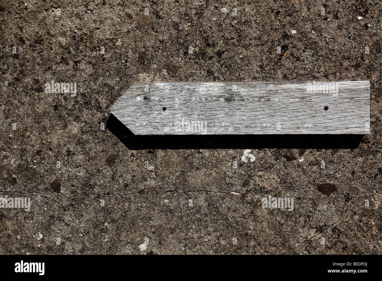 Blank wooden sign on stone wall Stock Photo - Alamy