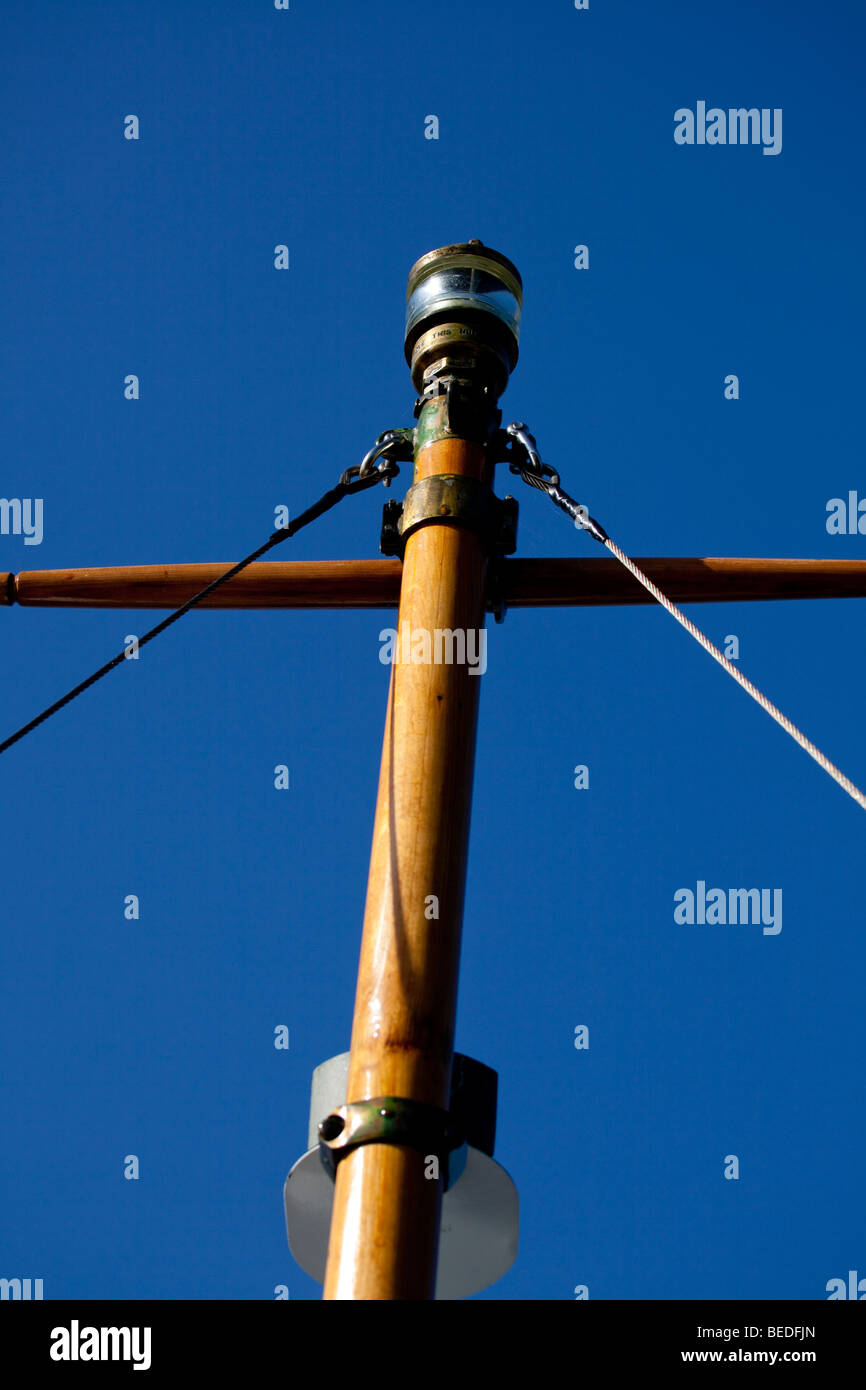 Fishing boat's mast against deep blue sky Stock Photo - Alamy
