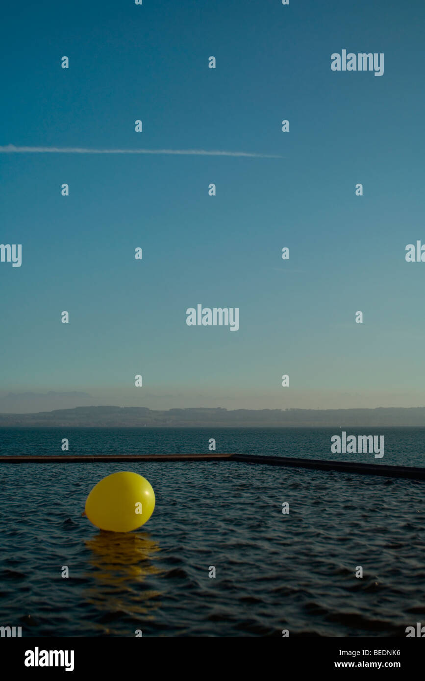 Balloon floating on lake Stock Photo - Alamy