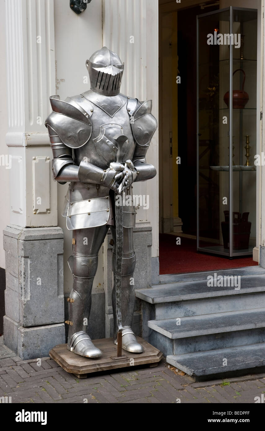 A suit of medieval armour beside a shop door entrance in the Hague (Den ...