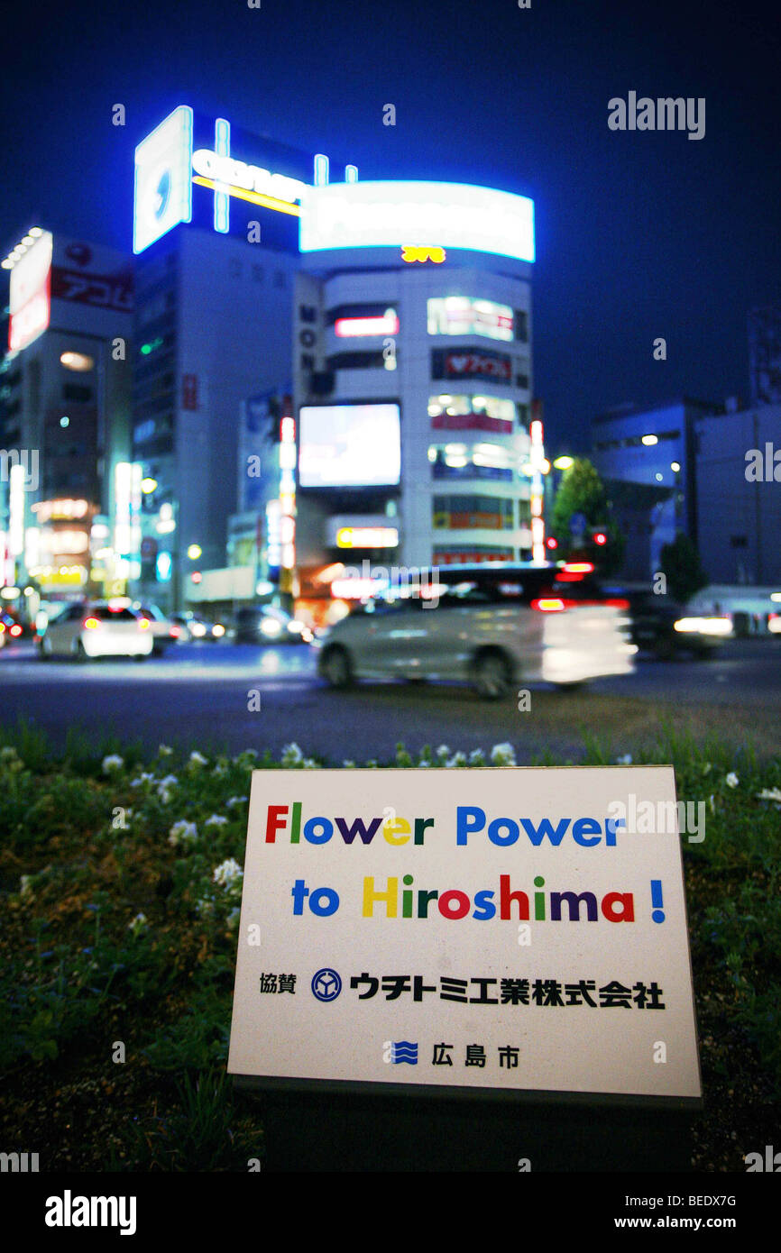 Sign saying 'Flower Power to Hiroshima' 64 years after the first Atomic ...