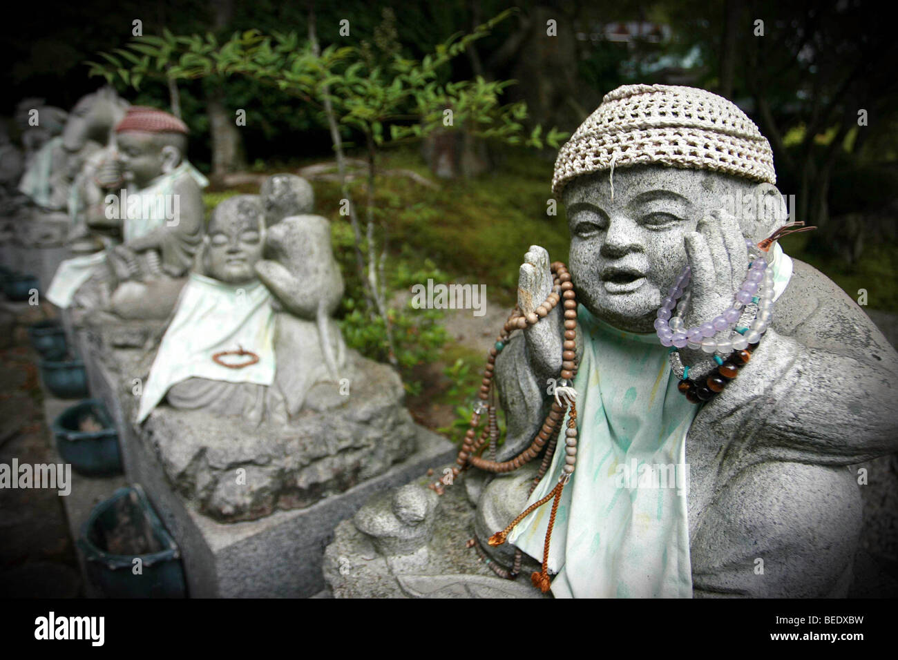 A stone Buddha statue in the Shinto Itsukushima Shrine on the island of ...