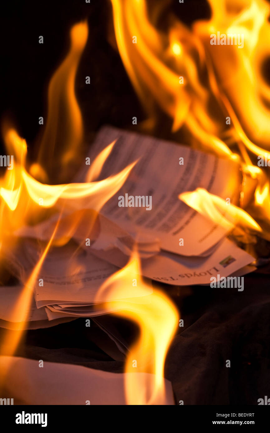 Burning Bank Statements during the Credit Crunch Stock Photo - Alamy