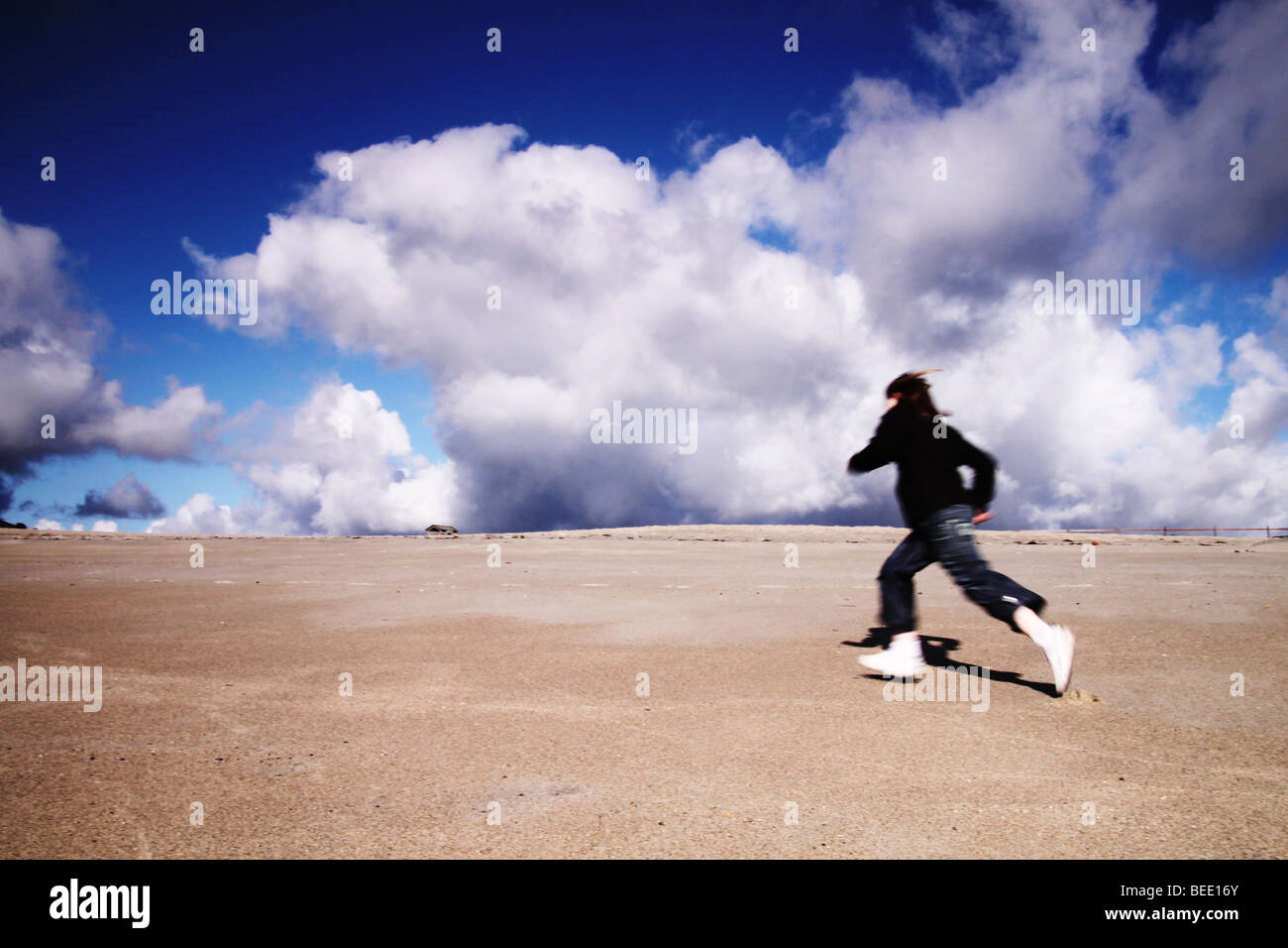 Trainers running beach hi-res stock photography and images - Alamy
