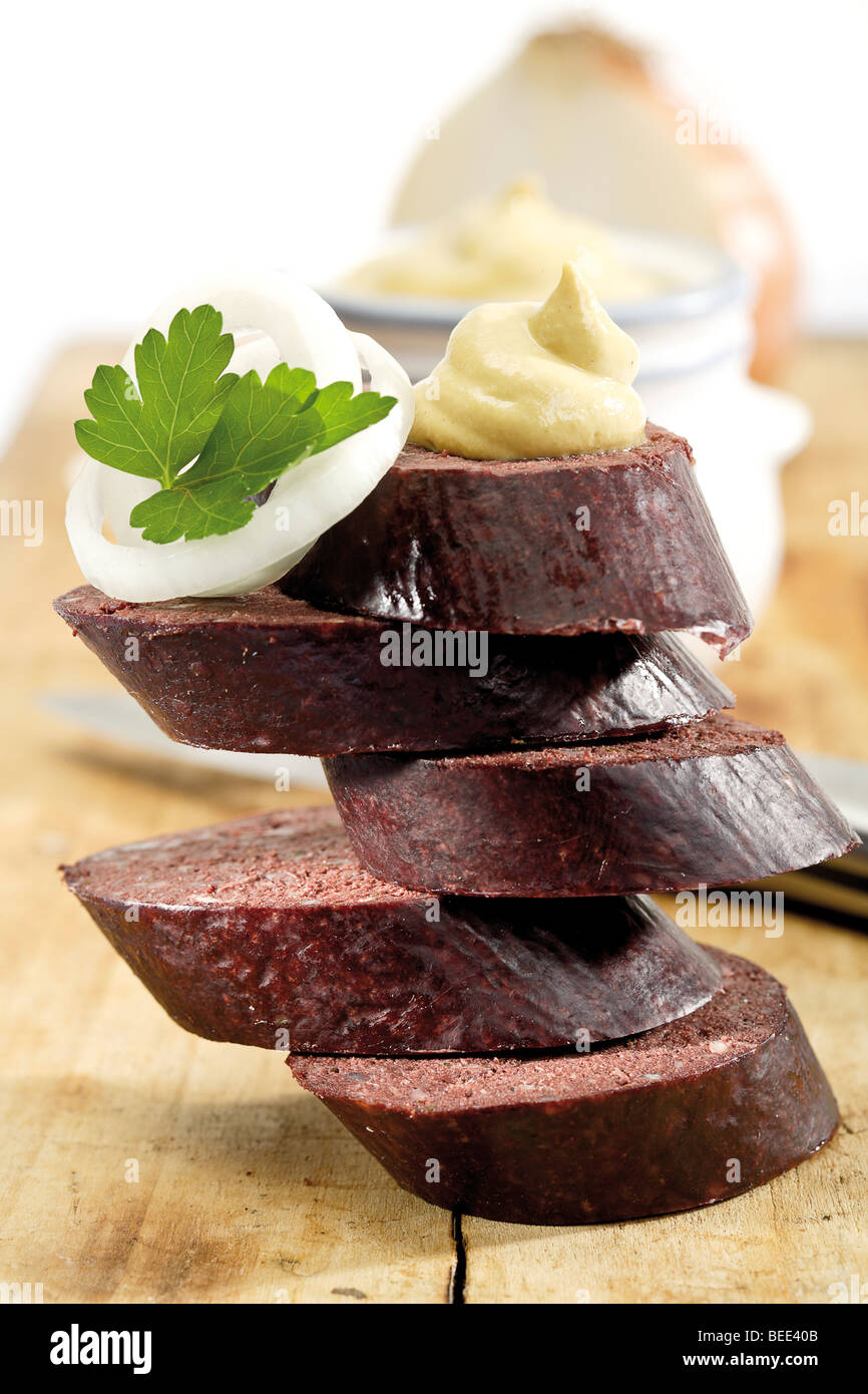 Stacked slices of Blutwurst, Black Pudding, with onion and mustard ...