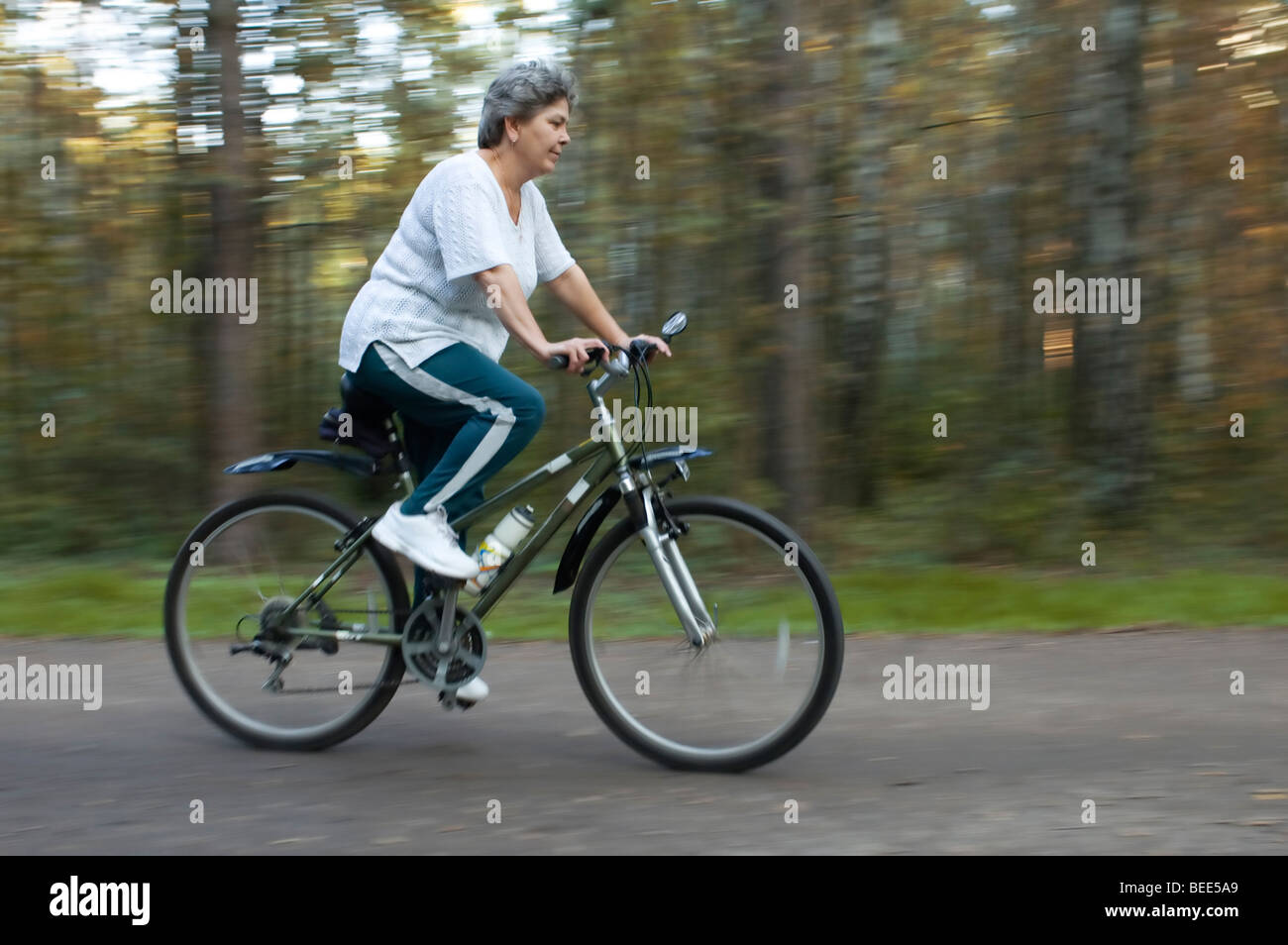 Woman on bicycle in country hi-res stock photography and images - Alamy