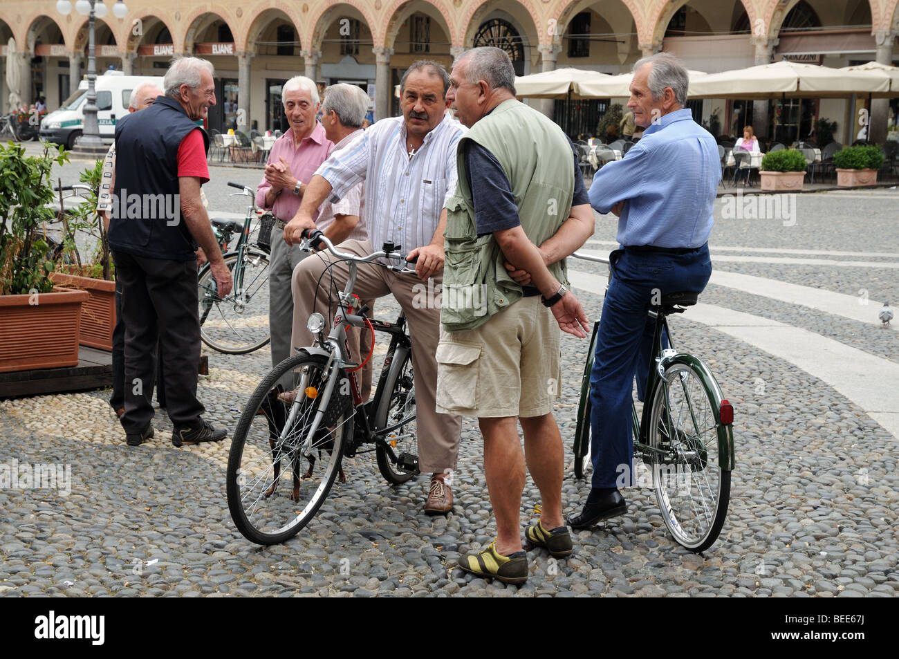 Group of elderly old retired men meeting for morning chat in the Piazza ...