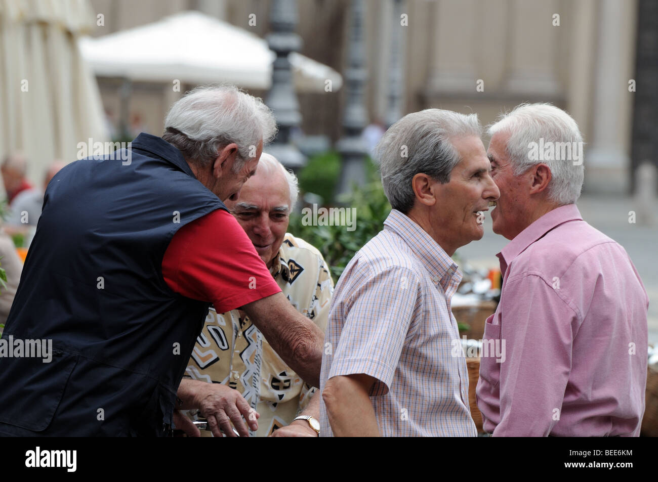 Group of elderly old retired men meeting for morning chat in the Piazza ...