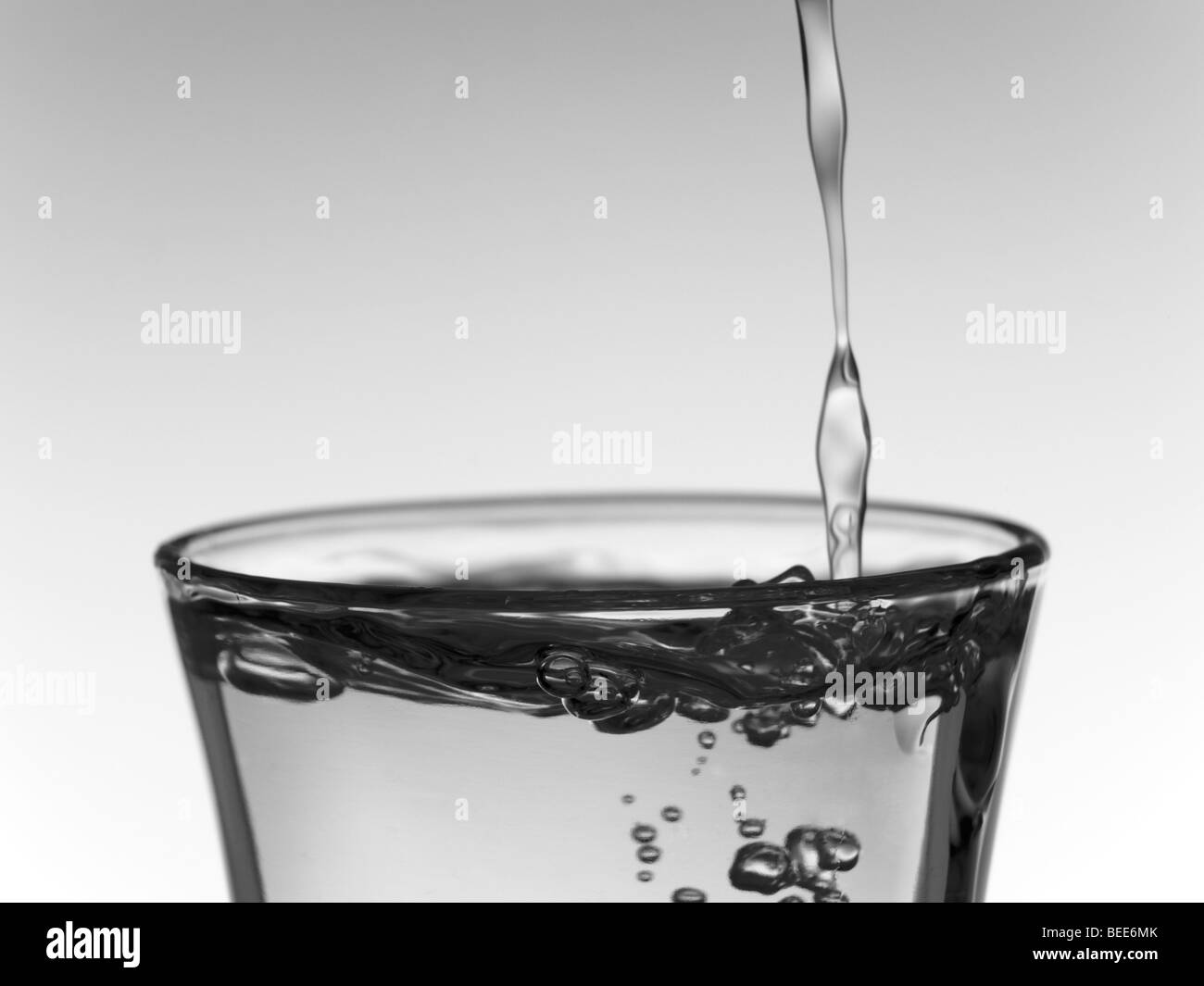 Pouring a shot of vodka Stock Photo - Alamy
