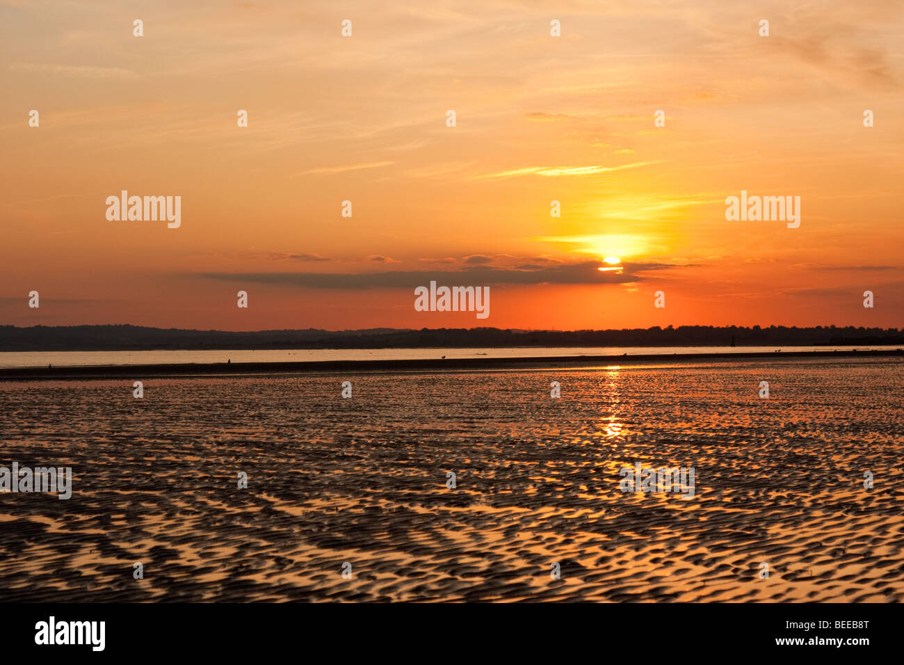 Deep orange sunset over Camber Sands in Sussex, England Stock Photo - Alamy