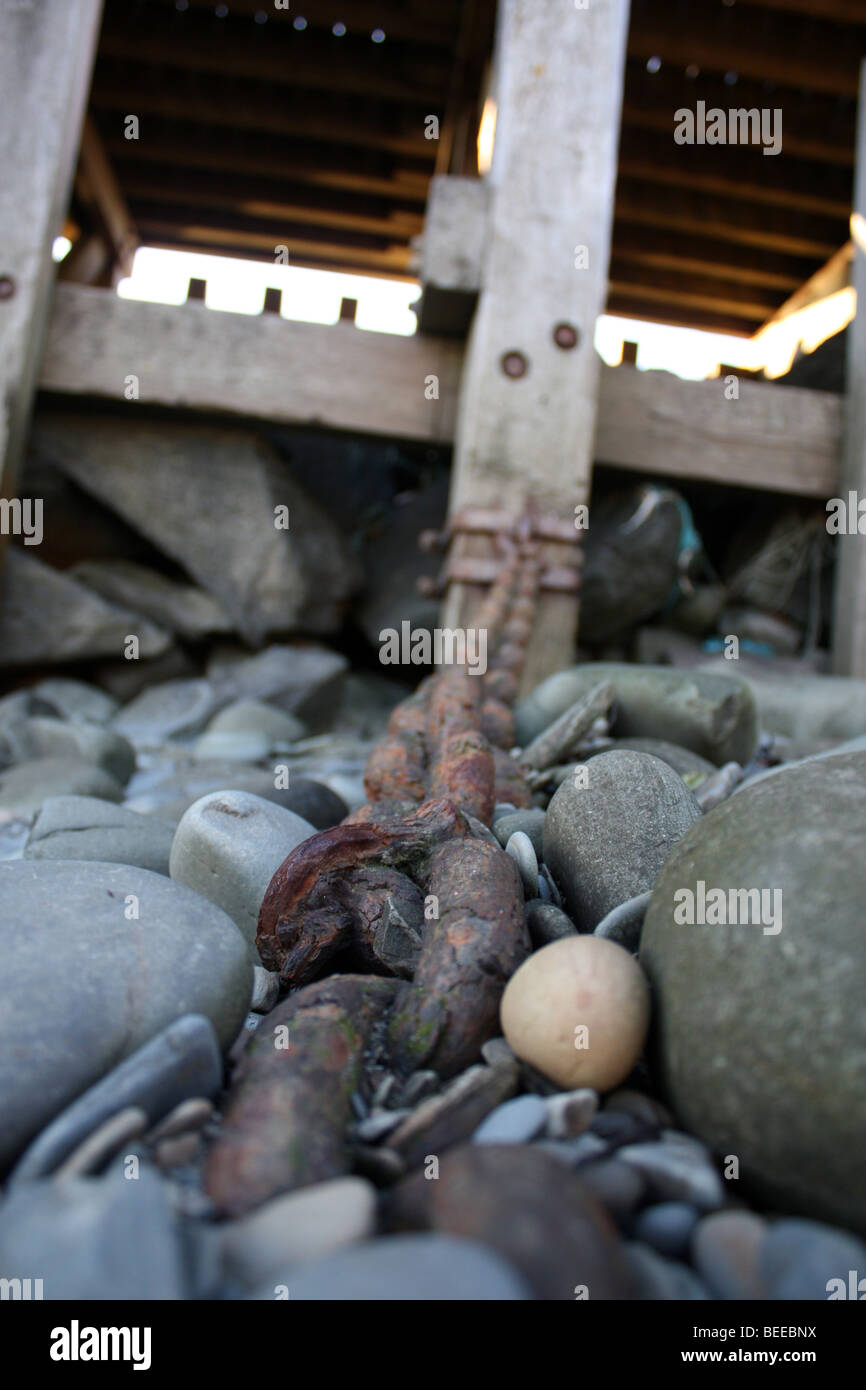 A chain down at a local harbour Stock Photo - Alamy