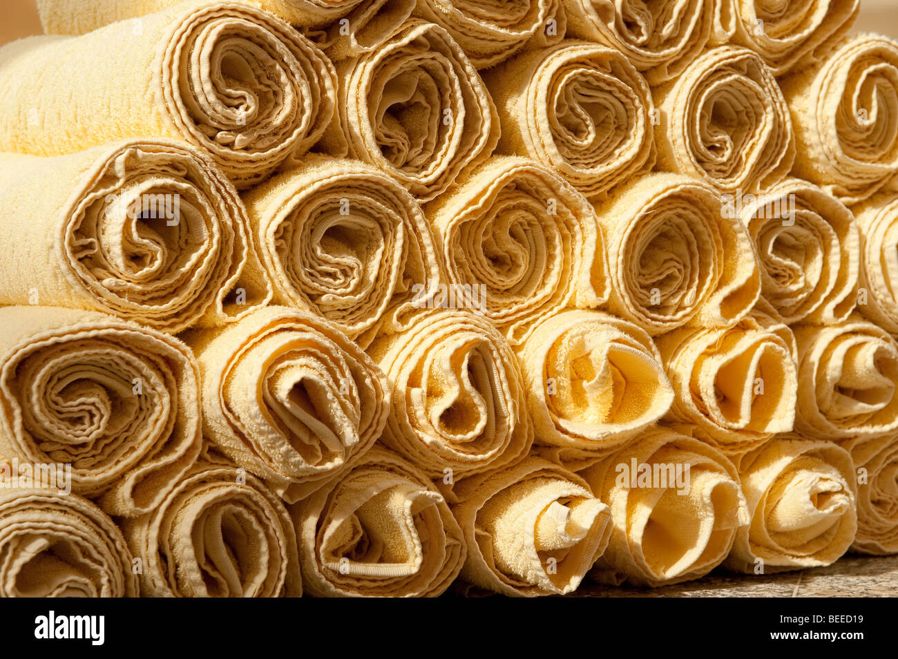 Rolled stack of towels at a spa Stock Photo - Alamy