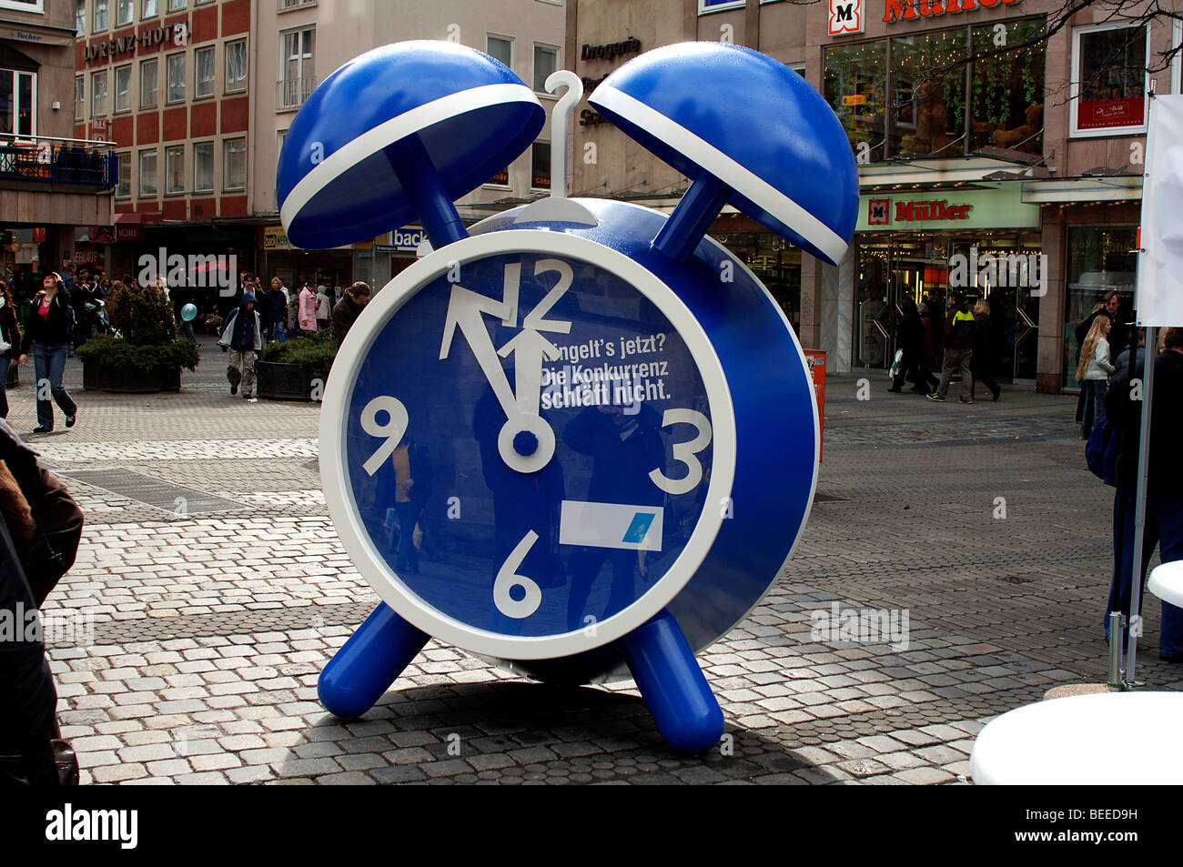 Blue alarm clock as an advertisement on the street, Nuremberg, Middle ...