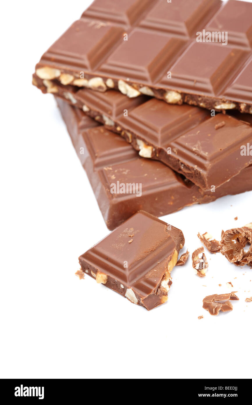 Blocks of chocolate isolated on white background. Shallow depth of ...