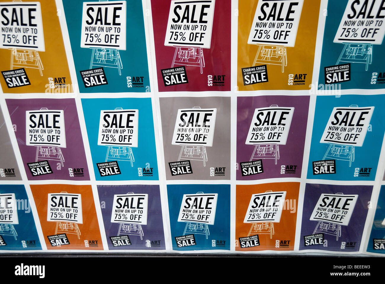 Bold, colourful sale signs in a shop window Stock Photo - Alamy