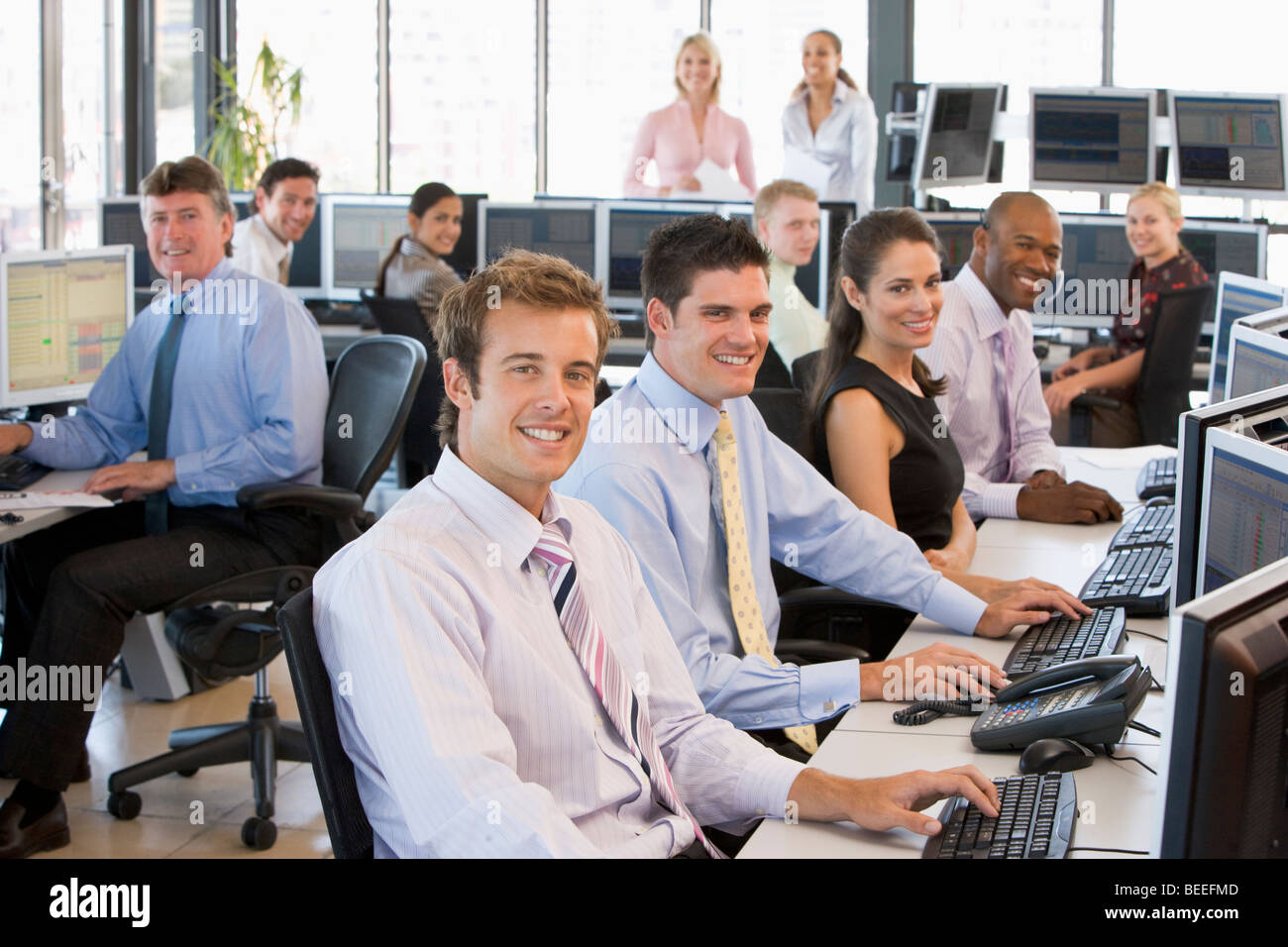 View Of Busy Stock Traders Office Stock Photo - Alamy