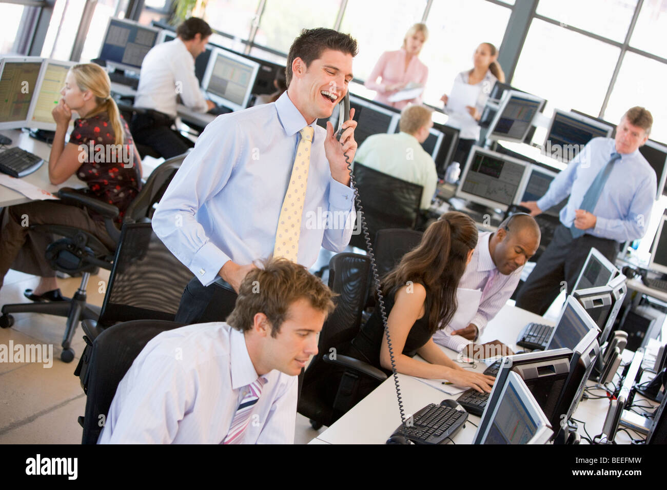 View Of Busy Stock Traders Office Stock Photo - Alamy